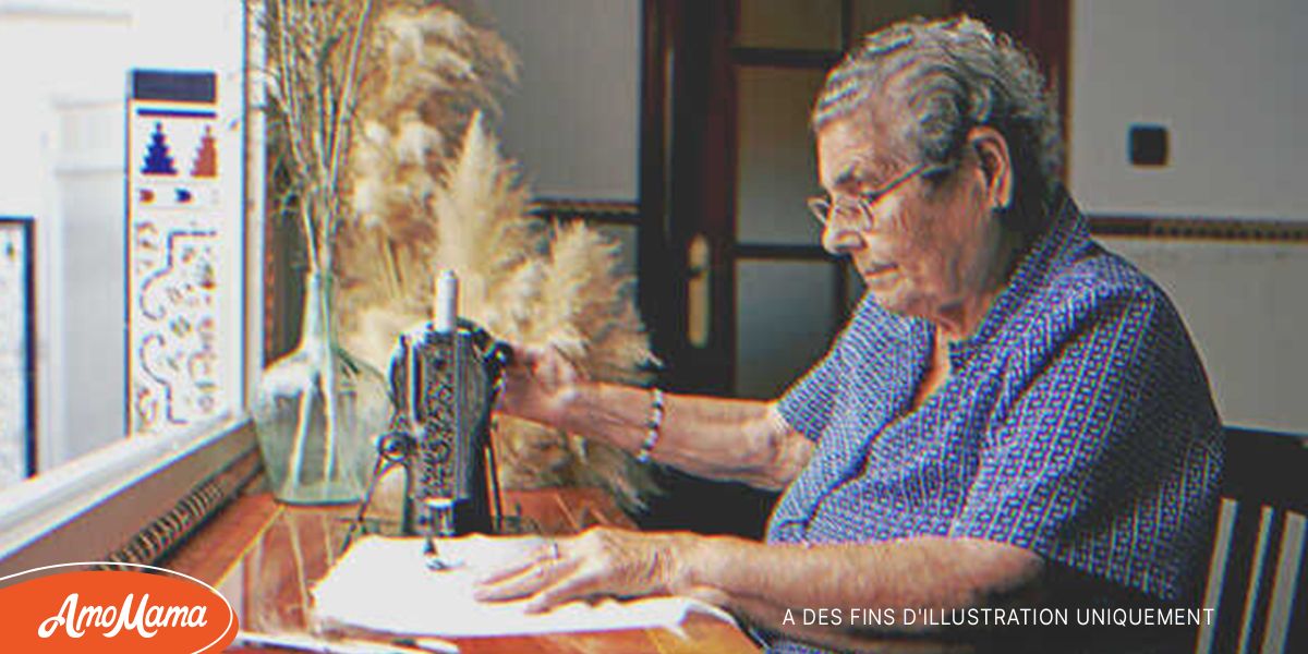 Une dame âgée coud une robe de bal pour la meilleure amie de son petit ...